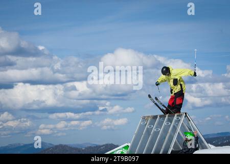 One male skier doing tricks in a terrain park at a ski resort Stock ...