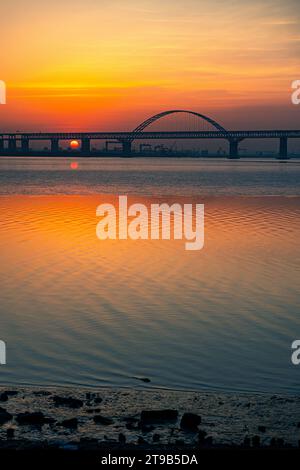 sunrise on Changjiang/ Yangtze River through a steel bridge Stock Photo ...