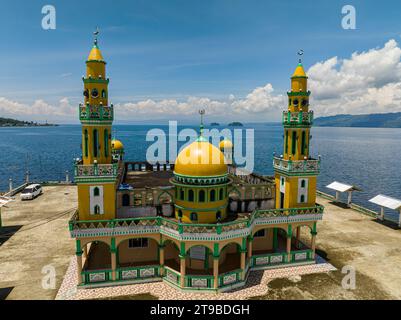 Tropical Landscape with Linuk Masjid mosque and Lake Lanao in Lanao del ...
