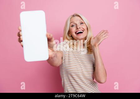 Photo of excited astonished lady hand touch cheek make selfie isolated ...