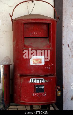The conventional Indian post box in a blur background of a street ...