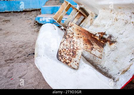 old rustic Ship's steering fin atached to plastic white old boat Stock ...