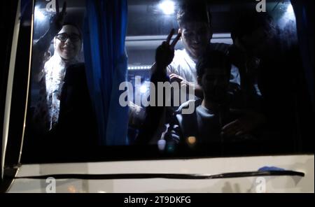 Beitunia. 24th Nov, 2023. Released Palestinian prisoners are seen on a ...