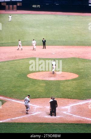 BRONX, NY - 1955: Pitcher Whitey Ford #16 of the New York Yankees goes ...