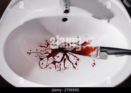 Closeup of dirty bathroom sink with blood splatter and knife Stock ...