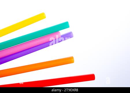 Different color of straw on a white background Stock Photo - Alamy