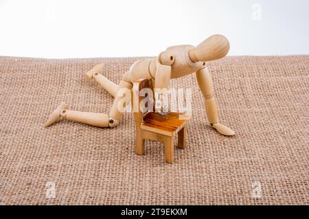 Little man figurine made of wood in view Stock Photo - Alamy