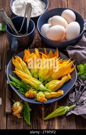 Preparation for roasted pumpkin flower made of pancake batter. Deep ...