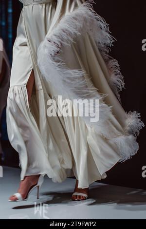 A detail of long white bridal dress Stock Photo - Alamy
