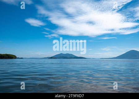 Tiny Islands Seen From Afar with Volcanic Mountains, Lush Vegetation ...
