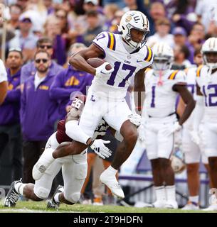 Wide receiver Chris Hilton Jr. (LSU Tigers, #03) carries the ball for a ...