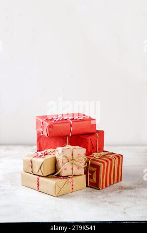 Christmas presents wrapped in ecological recycled paper with wooden ...