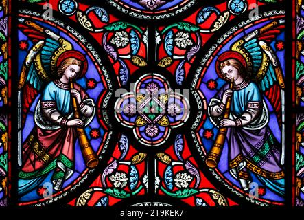 Stained glass window depicting musicians playing musical instruments ...