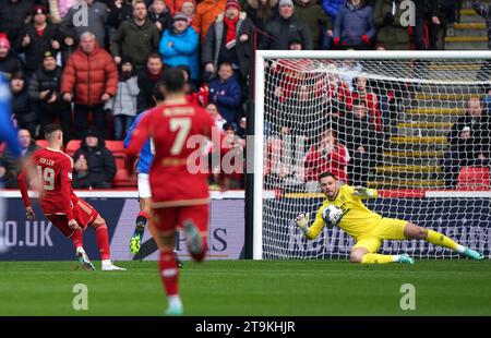 Rangers goalkeeper Jack Butland saves from Kilmarnock's Kyle Vassell ...