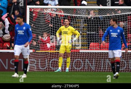 Rangers goalkeeper Jack Butland looks dejected after conceding the ...