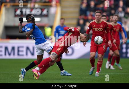 Aberdeen's Slobodan Rubezic (left) and Rangers' James Tavernier clash ...