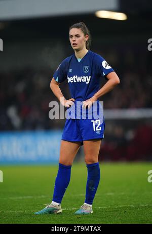 Emma Harries of West Ham Women drives forward with the ball and is ...