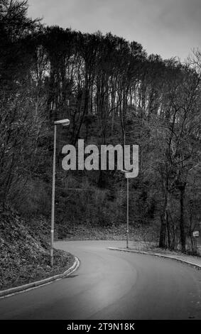 Twilight landscape with mountains and dim road Stock Photo - Alamy