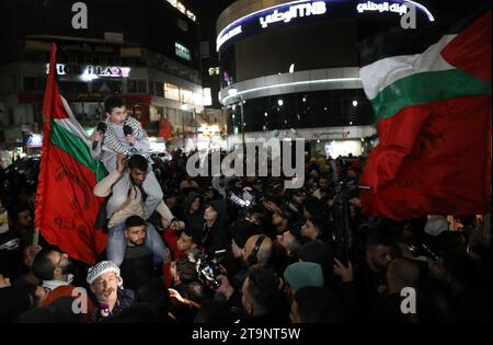 Ramallah, Palestinian Territories. 26th Nov, 2023. A bus arrives to ...