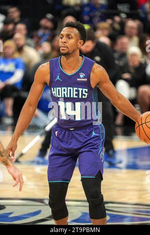 Charlotte Hornets guard Ish Smith, left, is guarded by Boston Celtics ...