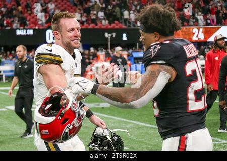 New Orleans Saints quarterback Tyler Shough (6) and tight end Taysom ...