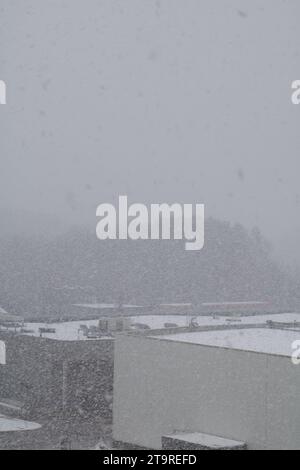 A serene winter scene unfolds in Gothenburg, as gentle snowfall covers ...