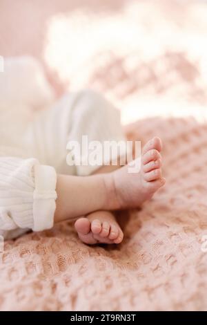 Close up of feet of a girl in red sneakers rides on blue plastic penny ...