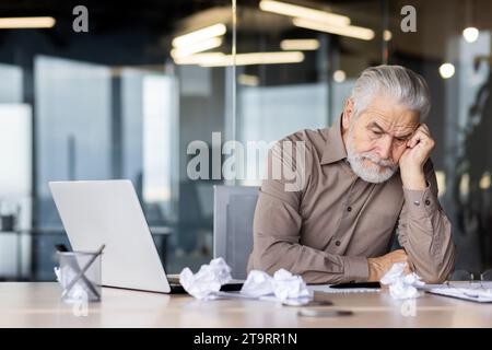 Old businessman employee sitting at workplace Stock Photo - Alamy