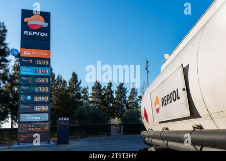 Marquee of the Repsol company at a service station indicating prices ...