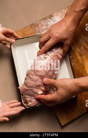 The process of stuffing turkey fillet for the Christmas table Stock ...