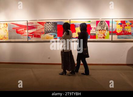 Two young Iranian women visit an interactive art show during Tehran ...