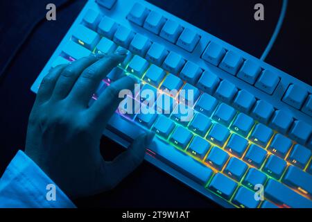 Closeup top view of white female hand with shiny glossy modern blue gel ...