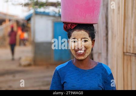 Malagasy girl with sun protection mask made from Musiro root at Begidro ...