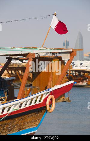 Qatari flag on dhow boat in Doha Stock Photo - Alamy