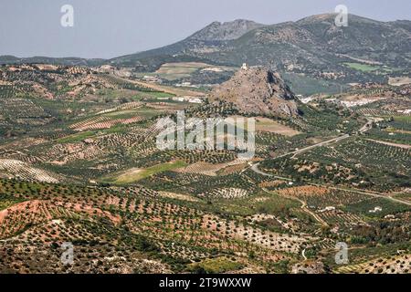 An ancient Moorish watch tower sits on a far hilltop surrounded by ...