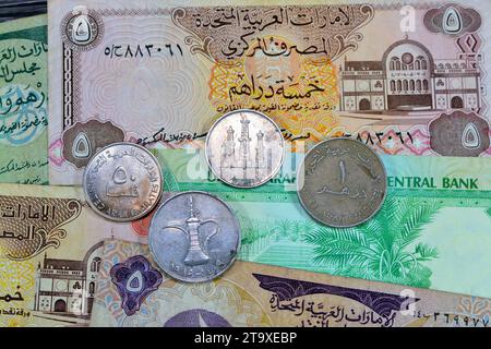 different UAE banknotes and coins background Stock Photo - Alamy