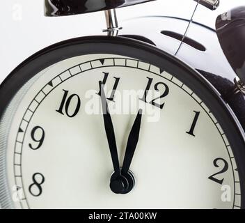 vintage alarm clock is showing midnight. It is twelve o'clock, holiday ...