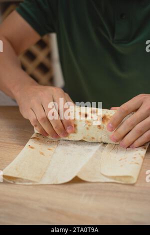 Man cooking homemade falafel in pita Stock Photo - Alamy