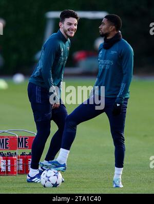 Arsenal's Declan Rice, centre left, challenges for the ball with ...