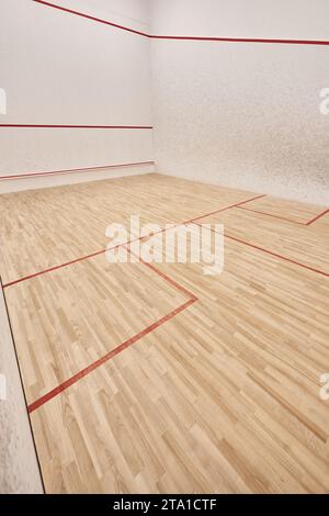 modern squash court room with white walls and red strip, motivation and ...