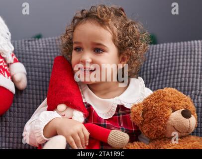 Adorable hispanic toddler smiling confident sitting on floor at ...