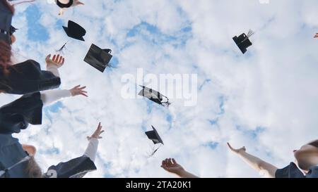 Graduation caps are thrown into the sky in celebration. 3d rendering ...