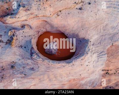 Photograph of the Cosmic Ashtray, a uniquely eroded sandstone formation ...