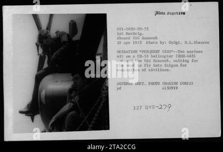 On April 29, 1975, Marines from the Marine Detachment processed ...