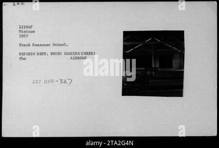 US Marines and Vietnamese buildings and bunkers are captured in this ...