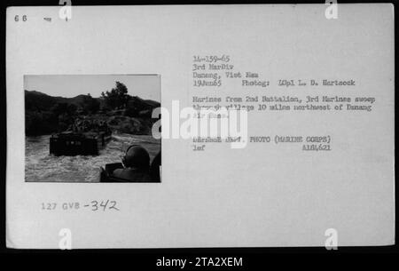 A LVT-5 vehicle of the 3rd Marine Division attempts to remove a crane ...