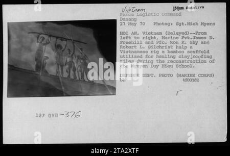 On May 27, 1970, Vietnamese civilians and CAP Marines work together to ...