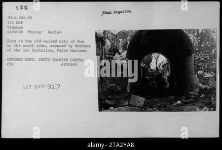 US Marines and Vietnamese buildings and bunkers are captured in this ...