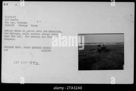 A LVT-5 vehicle of the 3rd Marine Division attempts to remove a crane ...