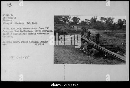 Marines of "K" Company, 3rd Battalion, Fifth Marines, advancing up a ...